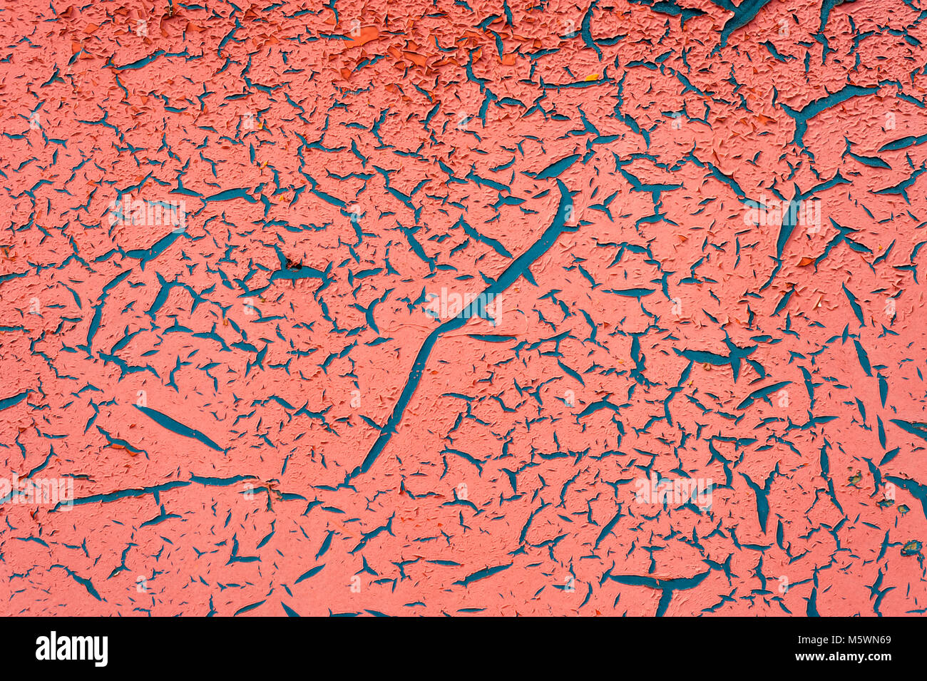 Red color peeling off a surface Stock Photo - Alamy