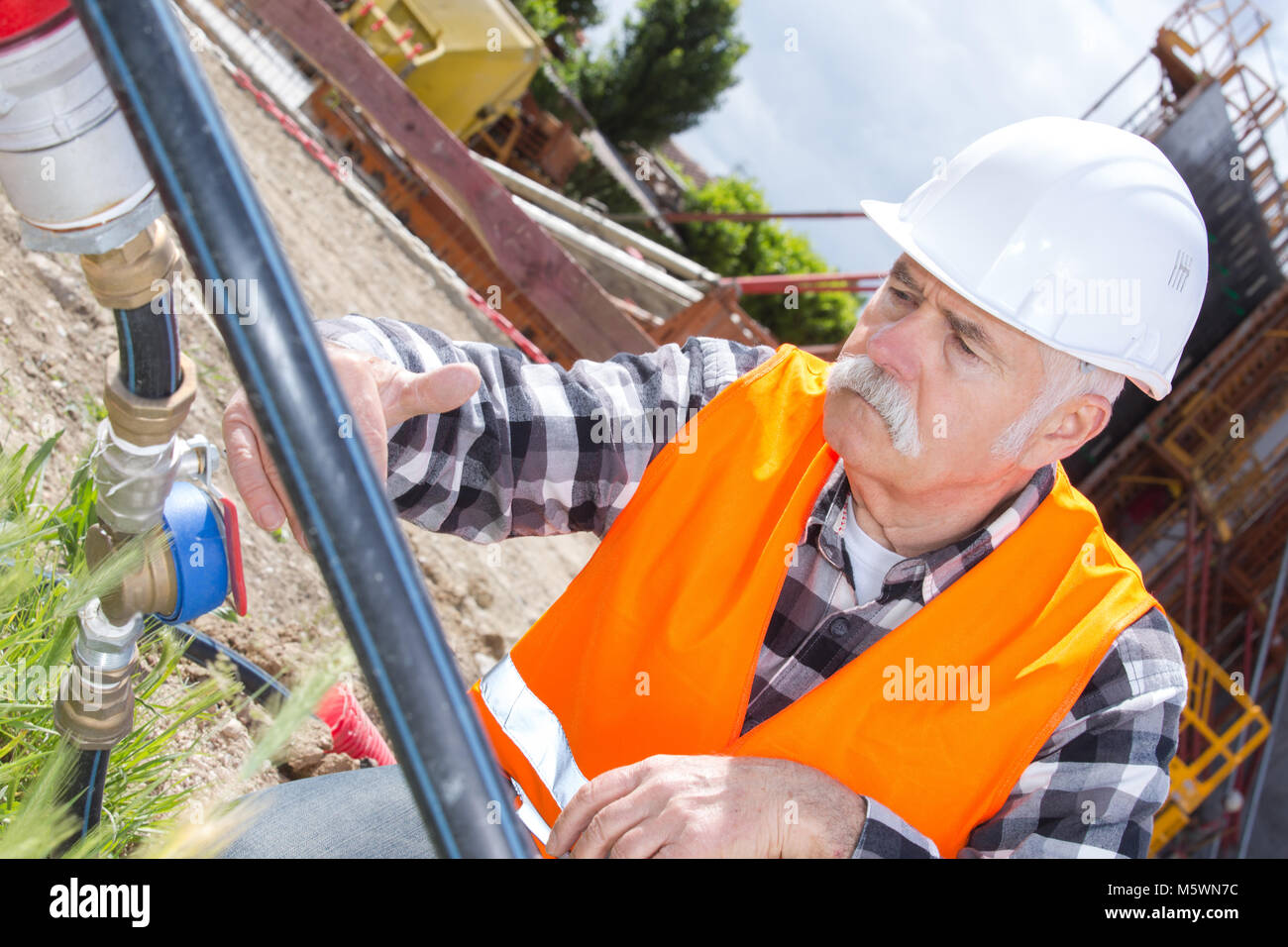 engineer builder at construction site Stock Photo - Alamy