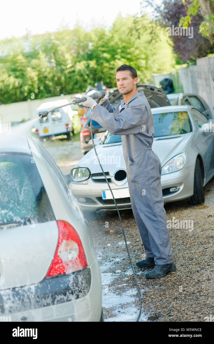 Man power washing a car Stock Photo - Alamy