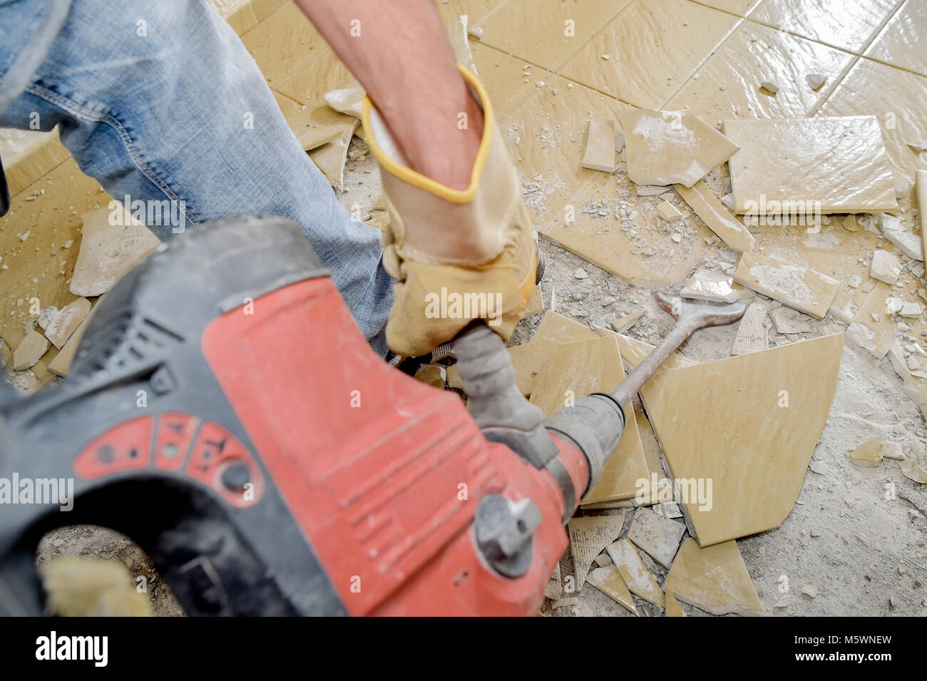 Removing old floor tiles Stock Photo - Alamy