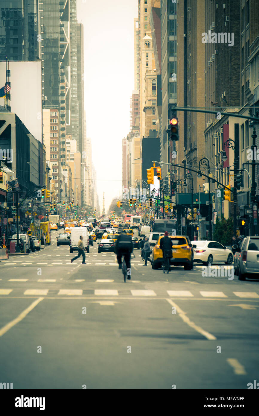 Busy New York City street with cars and pedestrians. Photograph has ...
