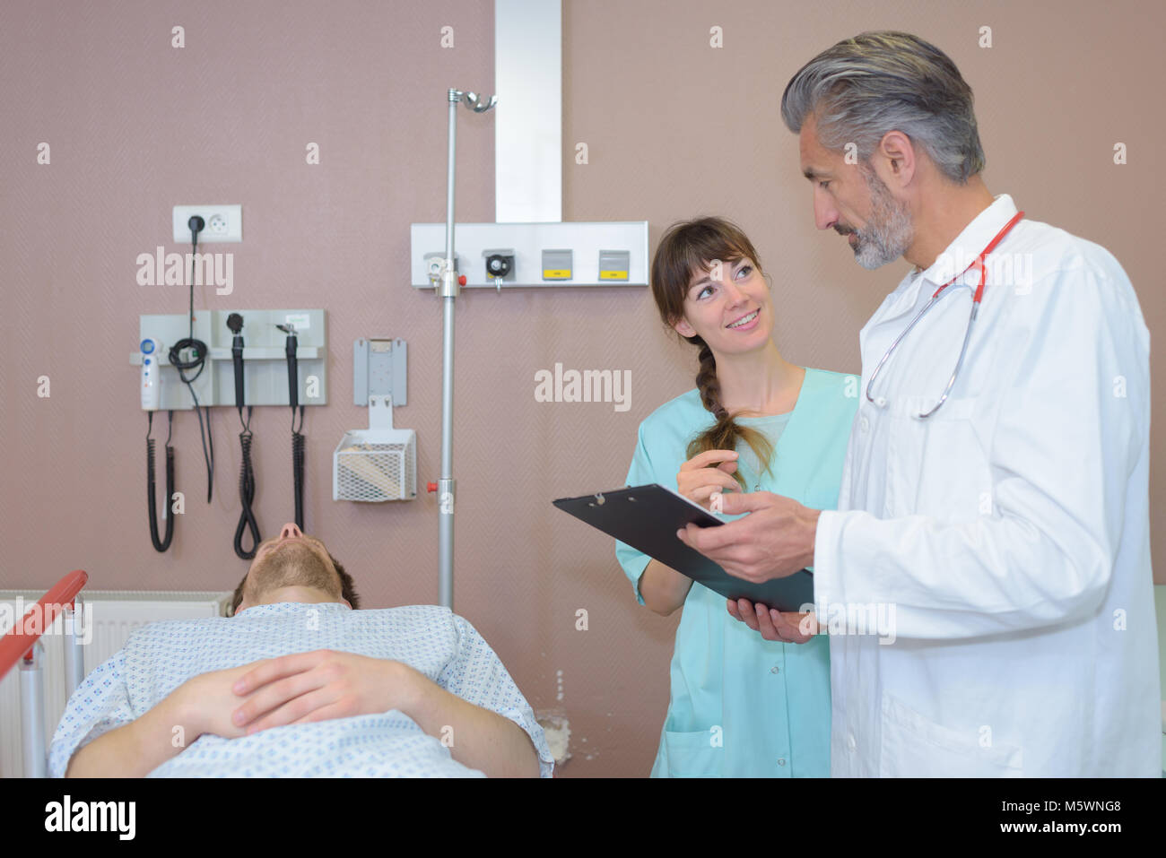 doctor and nurse checking patients status at the hospital Stock Photo ...