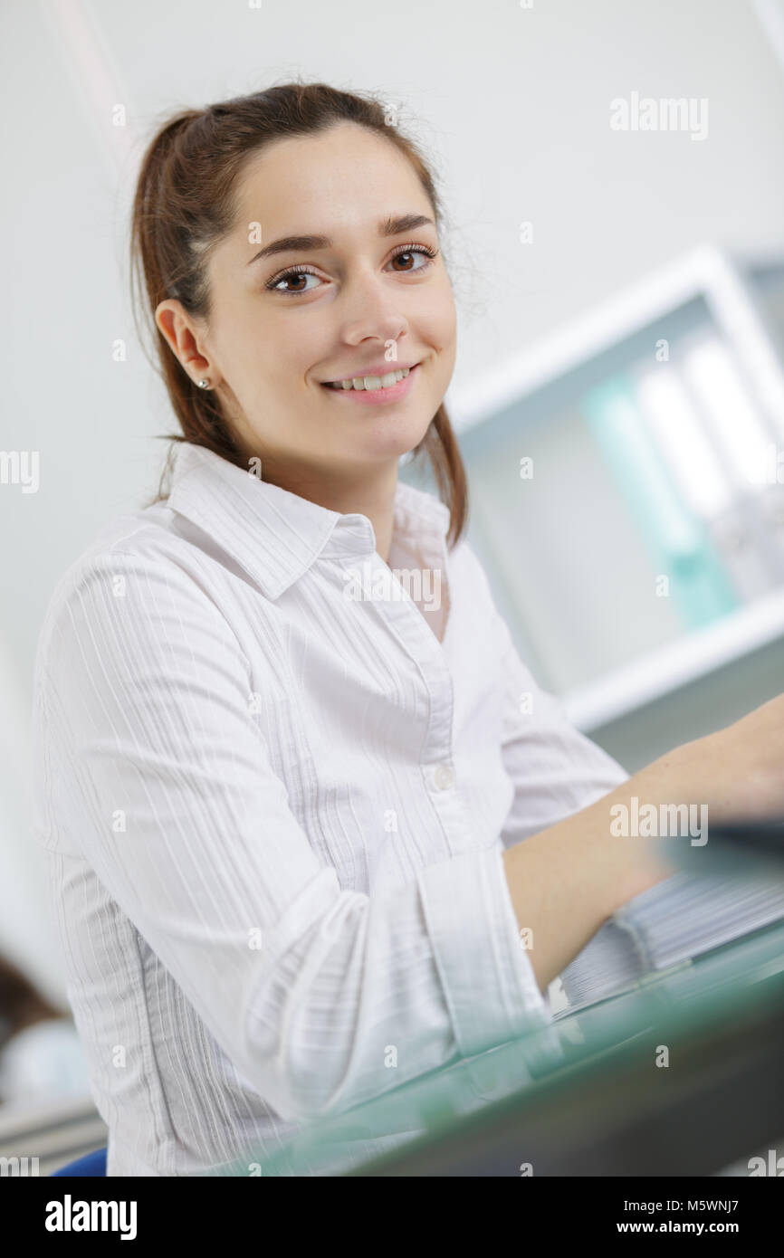 Portrait of young lady in office Stock Photo - Alamy