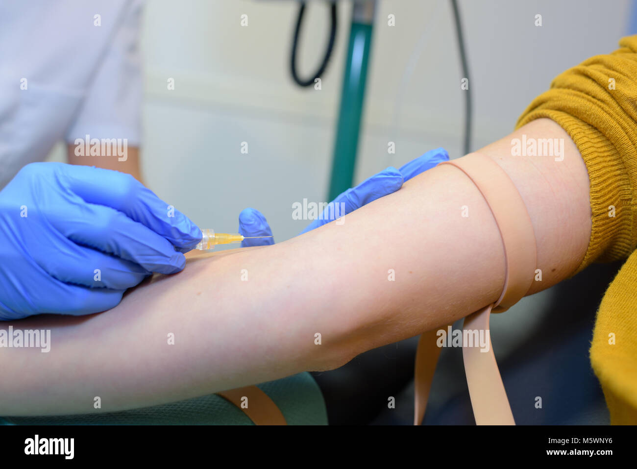 inserting a needle Stock Photo - Alamy