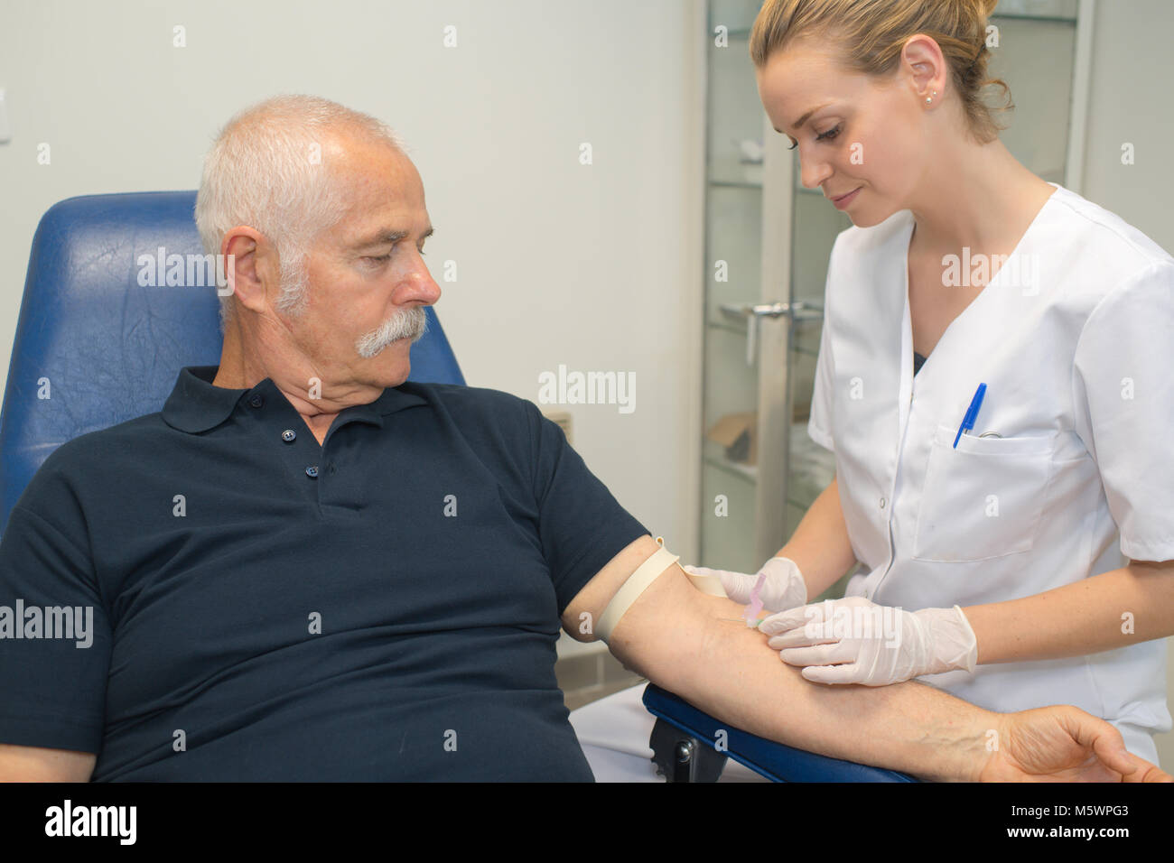 doctor making blood test for senior man Stock Photo - Alamy