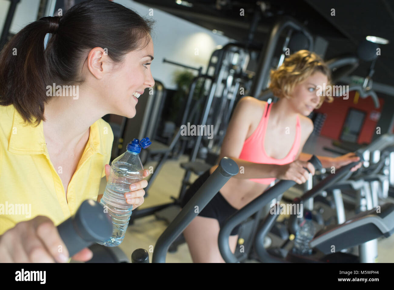 Women on exercise machine hi-res stock photography and images - Alamy