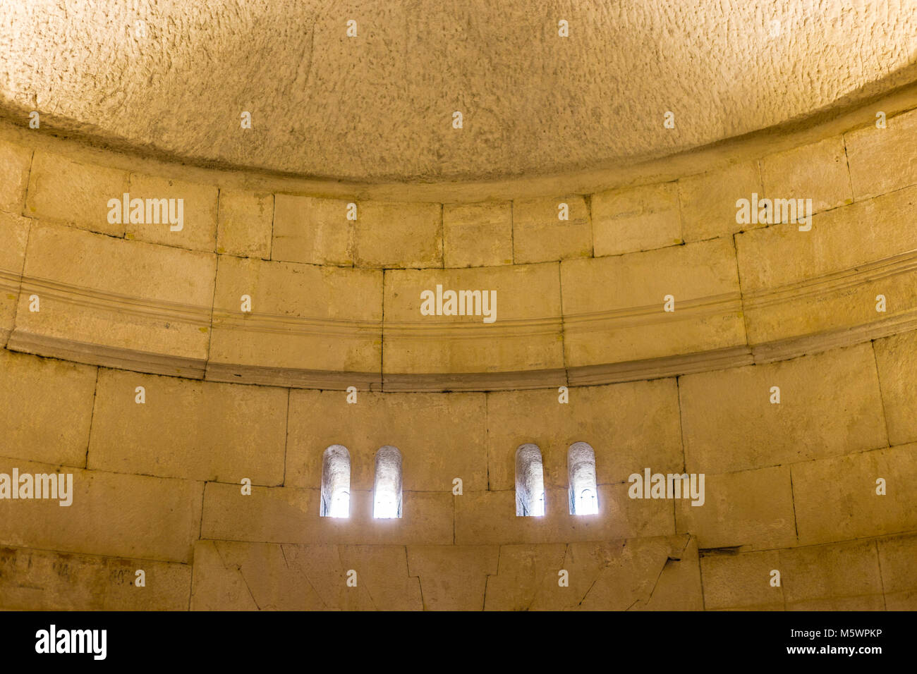 background of ancient windows on stone wall Stock Photo - Alamy