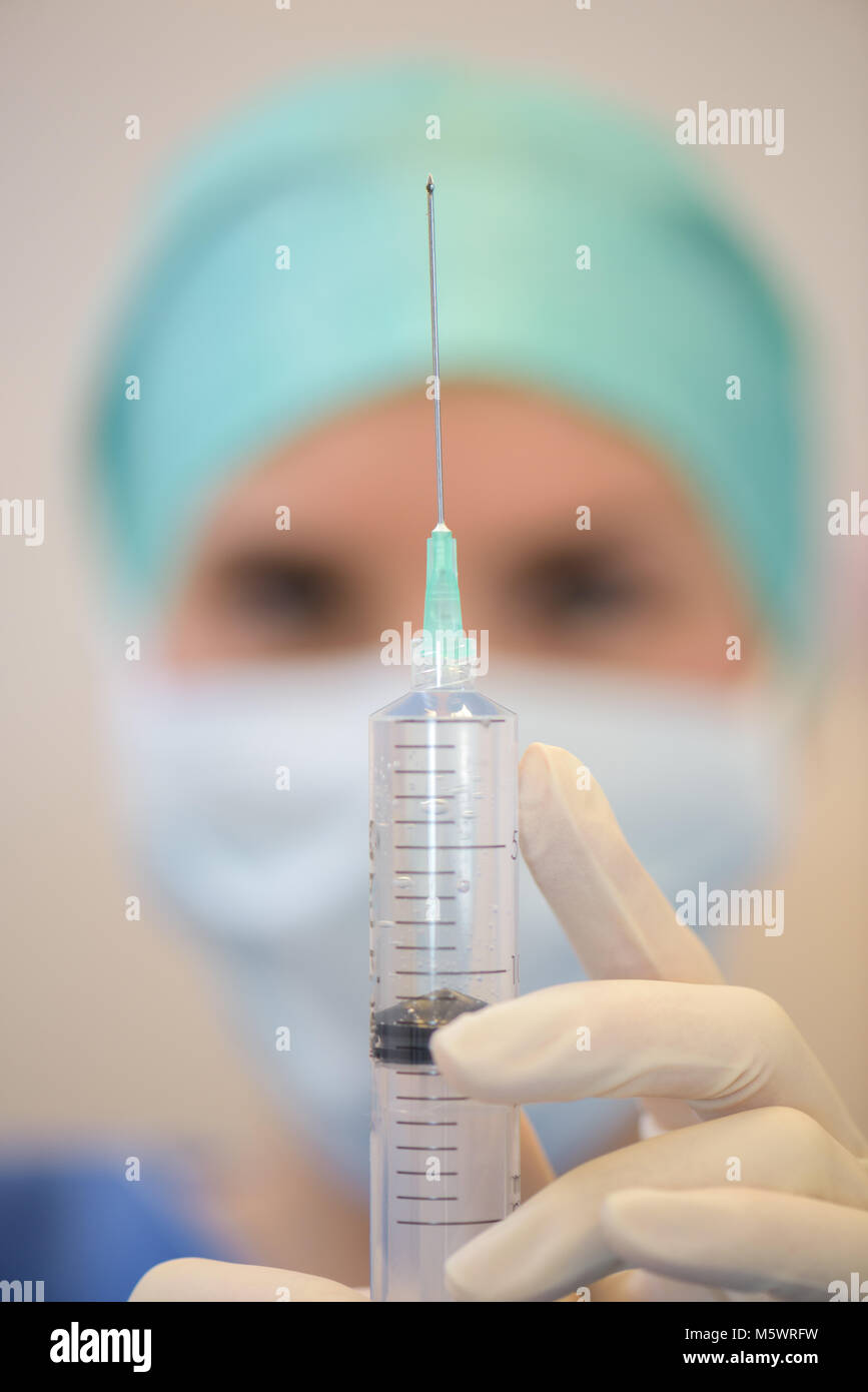 syringe medical injection in hand palm or fingers Stock Photo - Alamy