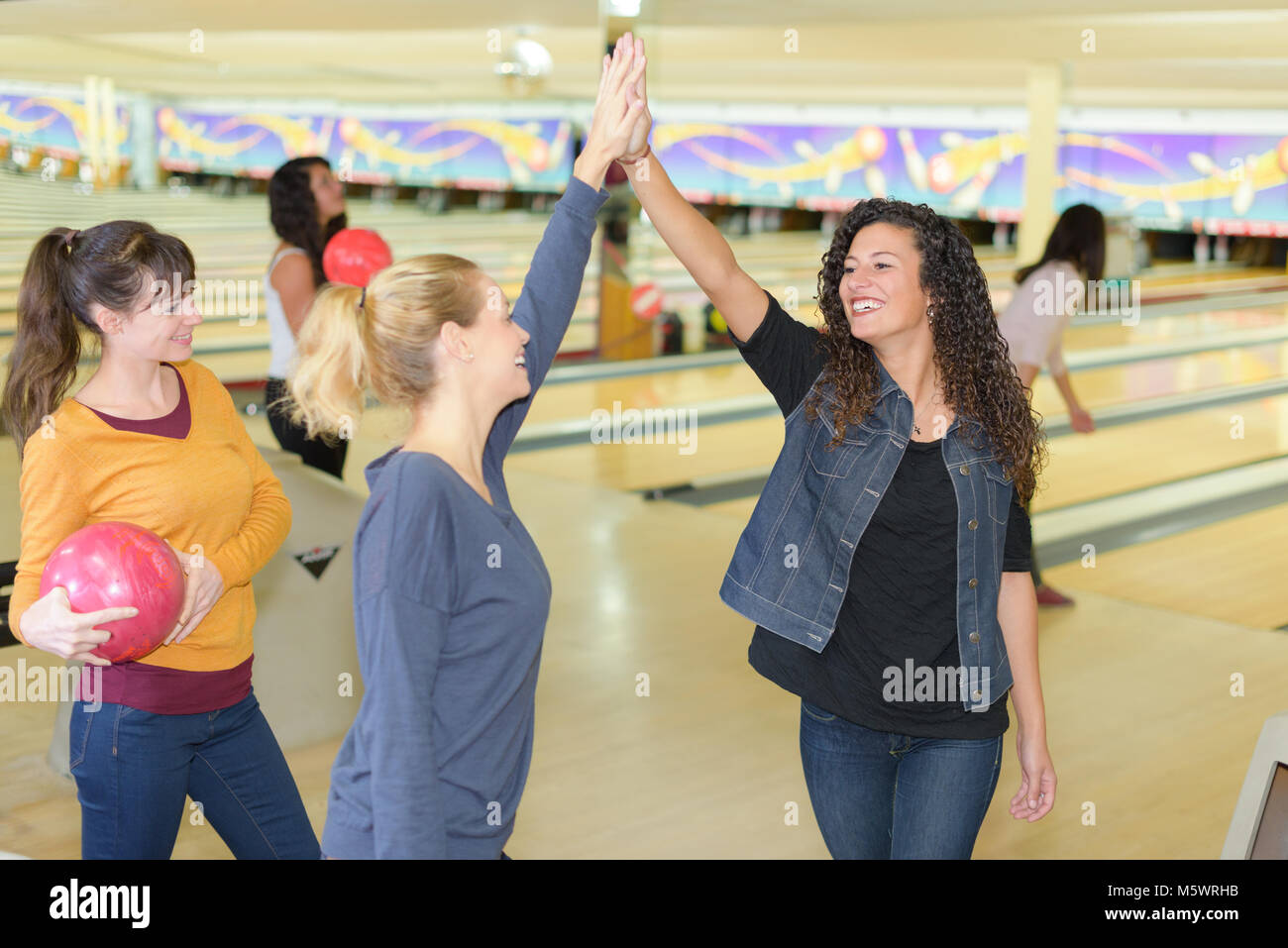 friends bowling at club and having fun playing casually Stock Photo - Alamy
