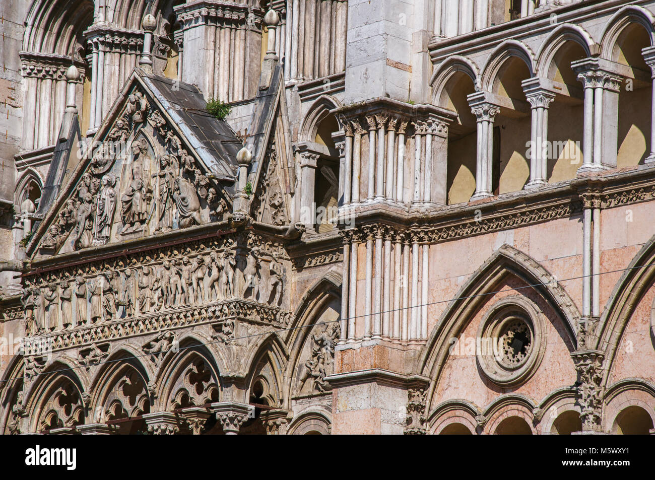 Front facade of Ferrara Cathedral, made in various types of marble. In ...