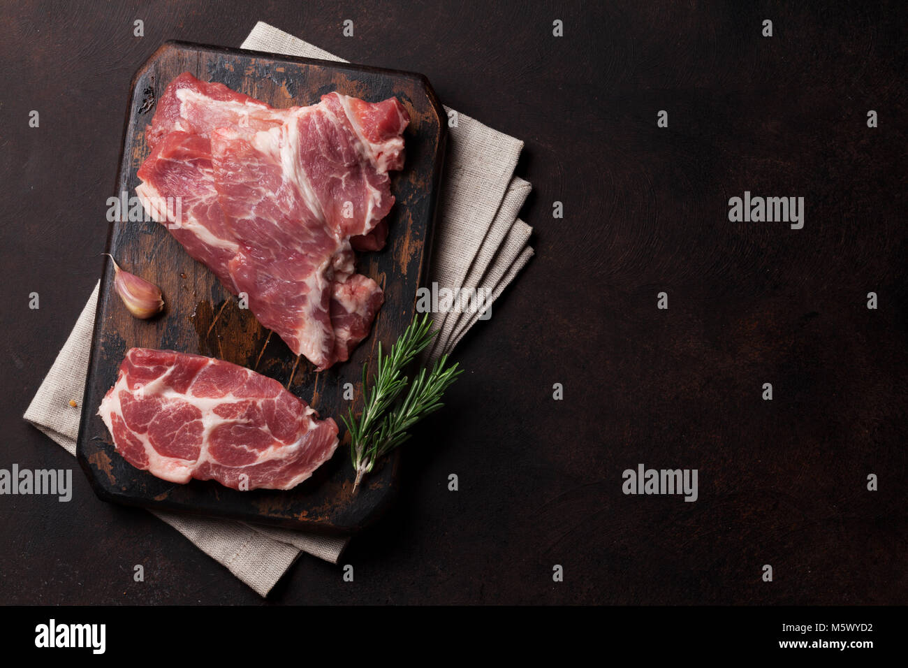 Raw pork meat cooking. Top view with space for your recipe or menu ...