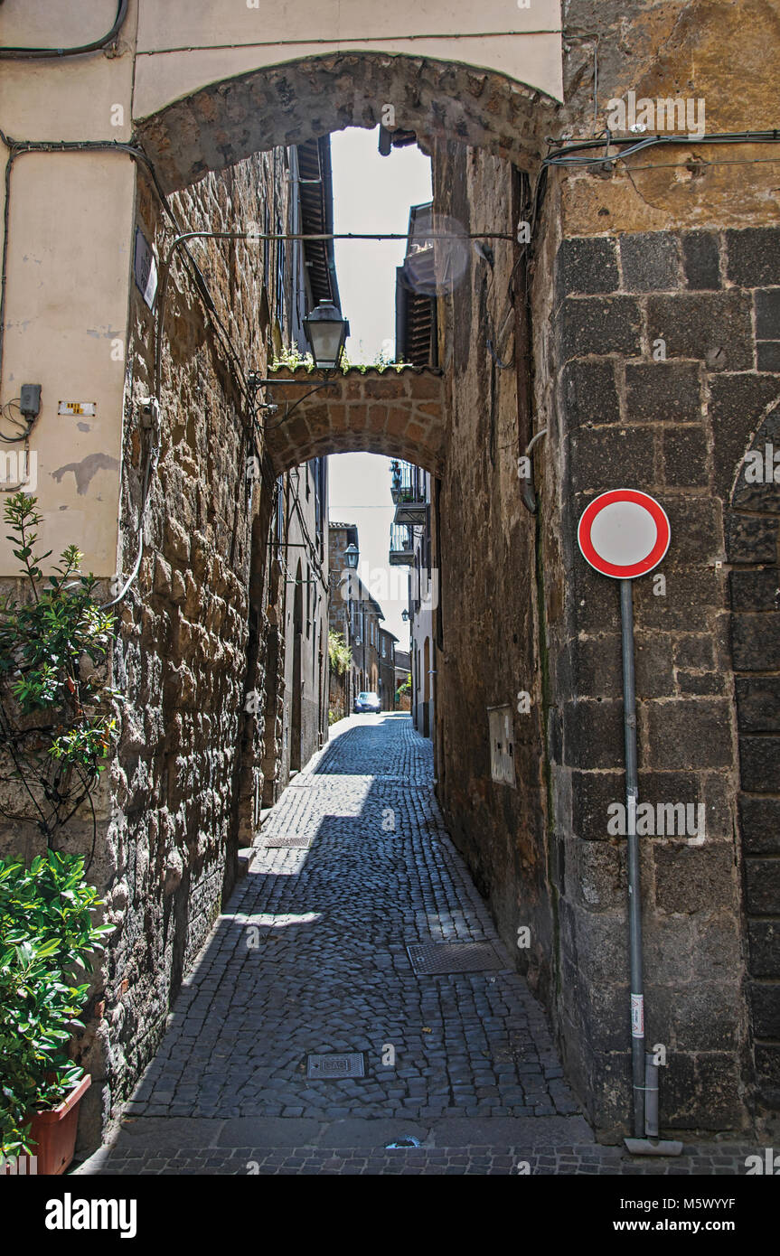 Orvieto, Italy. View of an alley with old buildings and wooden door ...