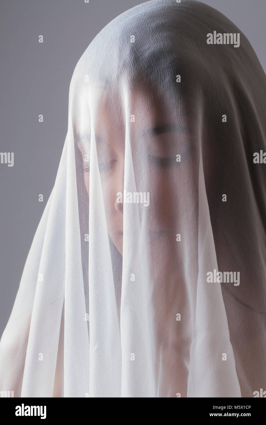 Woman face covered fabric hi-res stock photography and images - Alamy