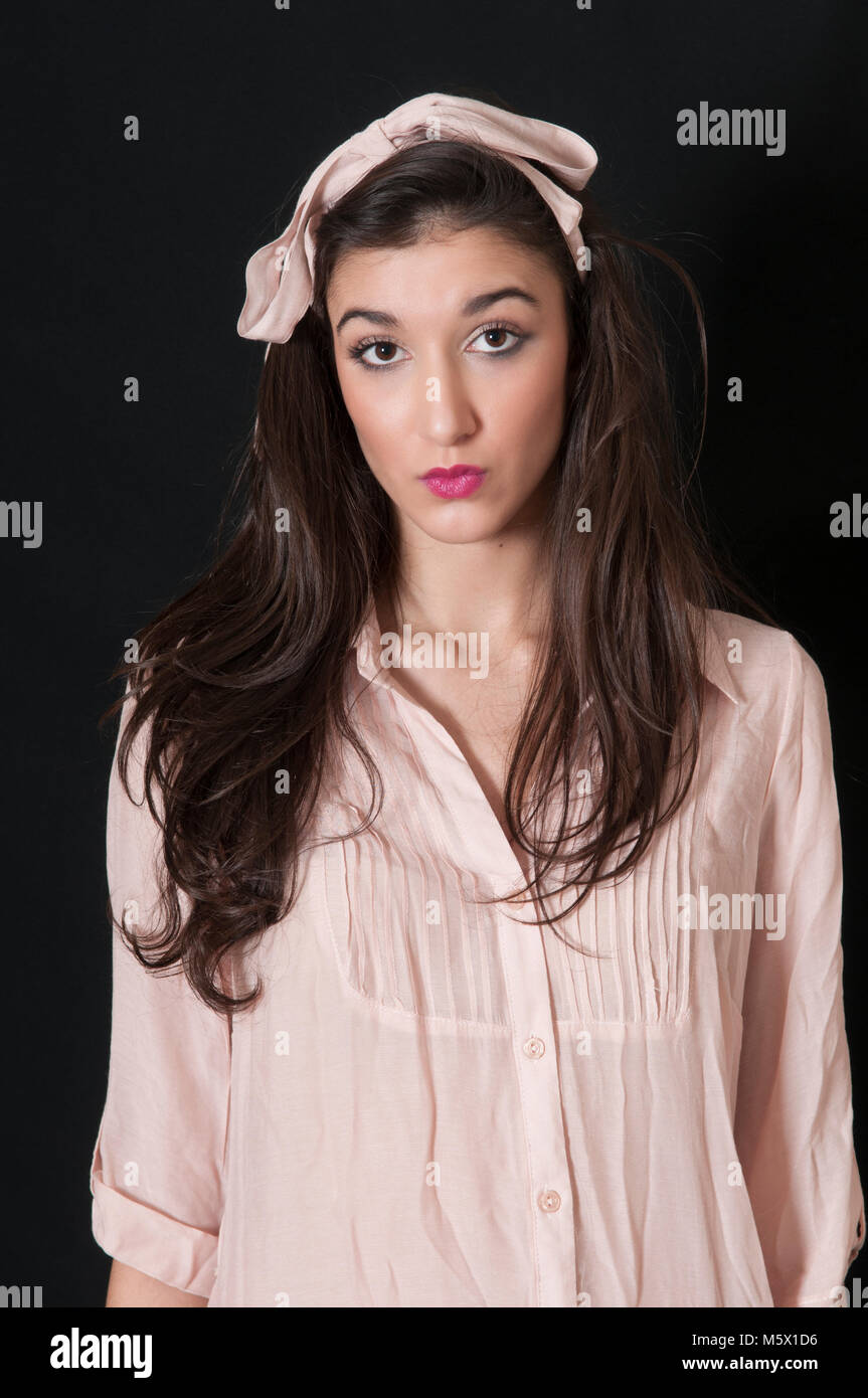 Beautiful young woman wearing a pink shirt Stock Photo - Alamy