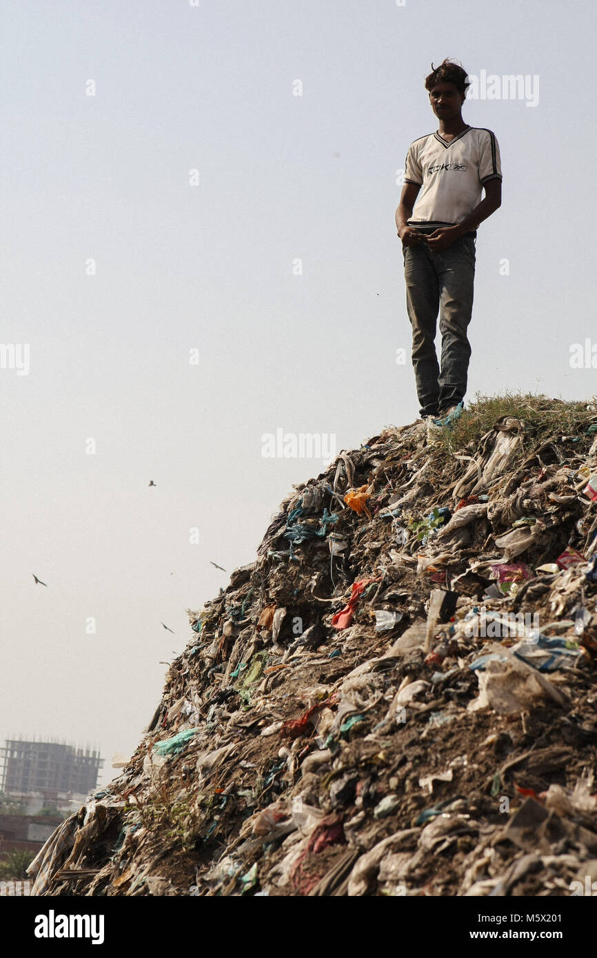 New Delhi, Delhi, India. 1st Oct, 2014. A man seen standing on a pile ...