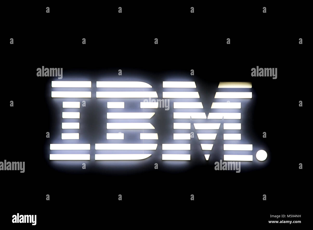 Barcelona, Spain. 26 February, 2018: An 'IBM' logo sits illuminated ...