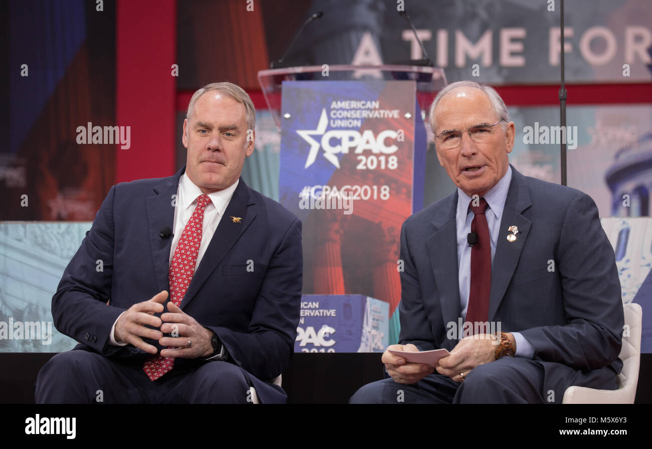 Secretary of Interior Ryan Zinke (left) appears in conversation with ...