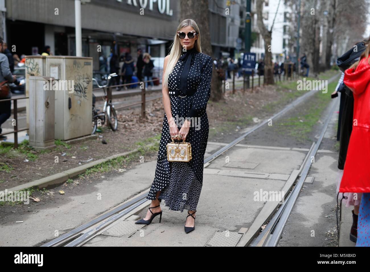 A chic showgoer attending the Dolce & Gabbana show during Milan Fashion ...