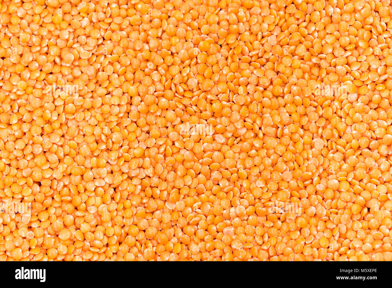 Background with red lentils Stock Photo - Alamy