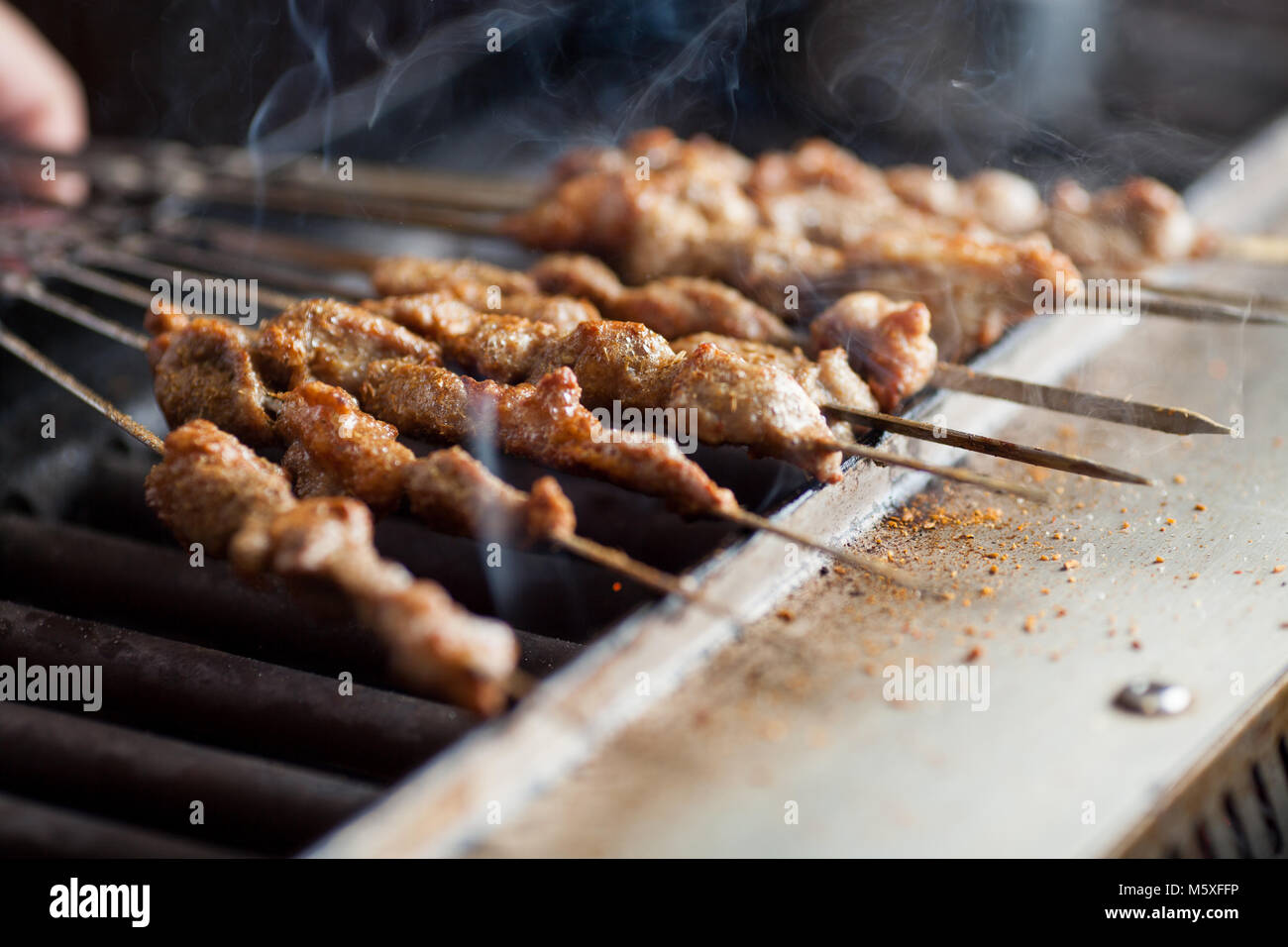 Chinese roasted lamb kebabs, Xinjiang cuisine Stock Photo - Alamy