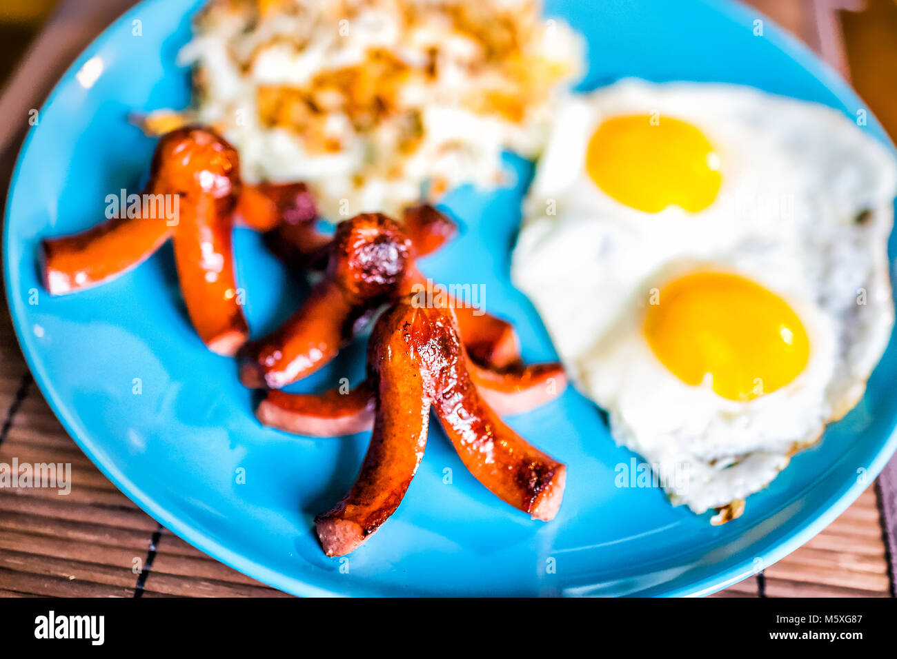 Closeup of large breakfast brunch plate with fried eggs, hash browns ...