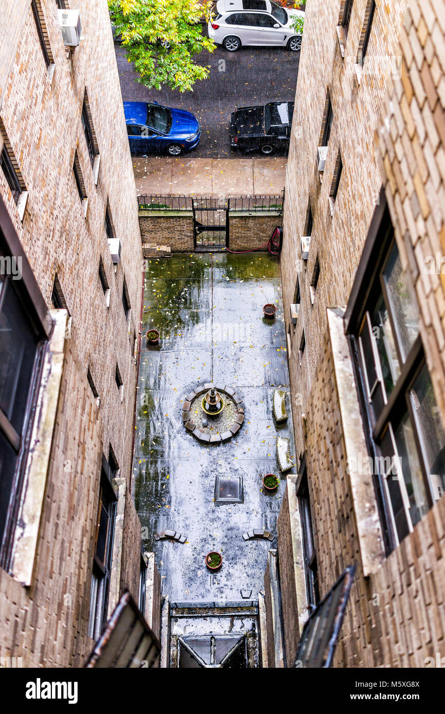 Residential apartment building and street road with sidewalk between in ...