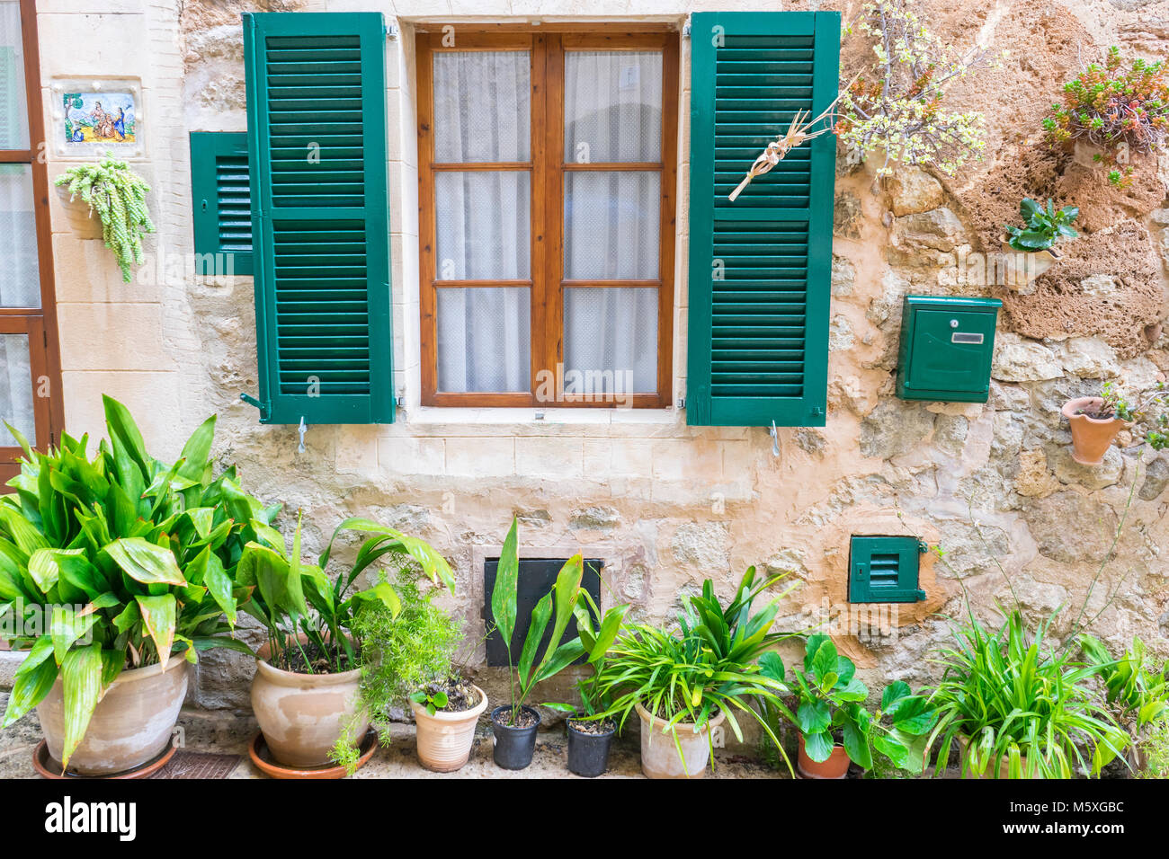 old window in a coastal village of the island of Mallorca in Spain ...