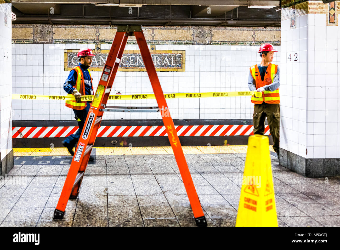 New York City, USA - October 29, 2017: Employee worker inspecting leak ...