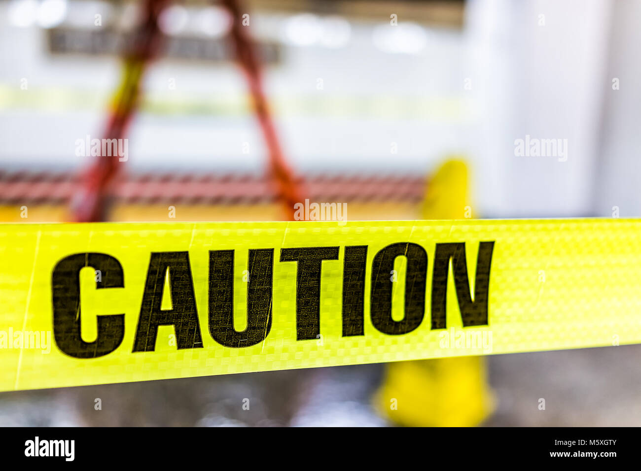 Caution tape sign in underground transit empty large platform in New ...