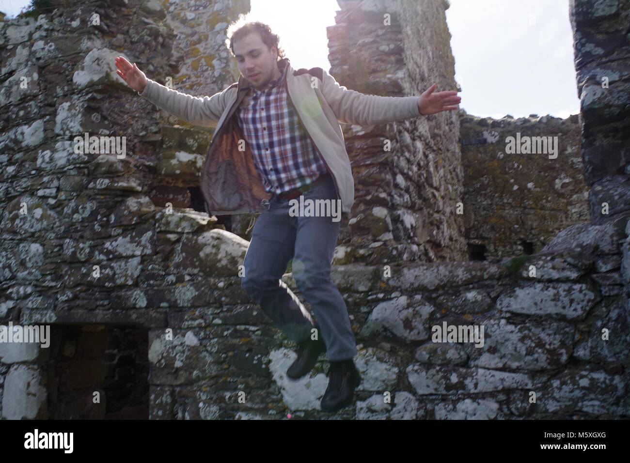 Young man falling from building hi-res stock photography and images - Alamy