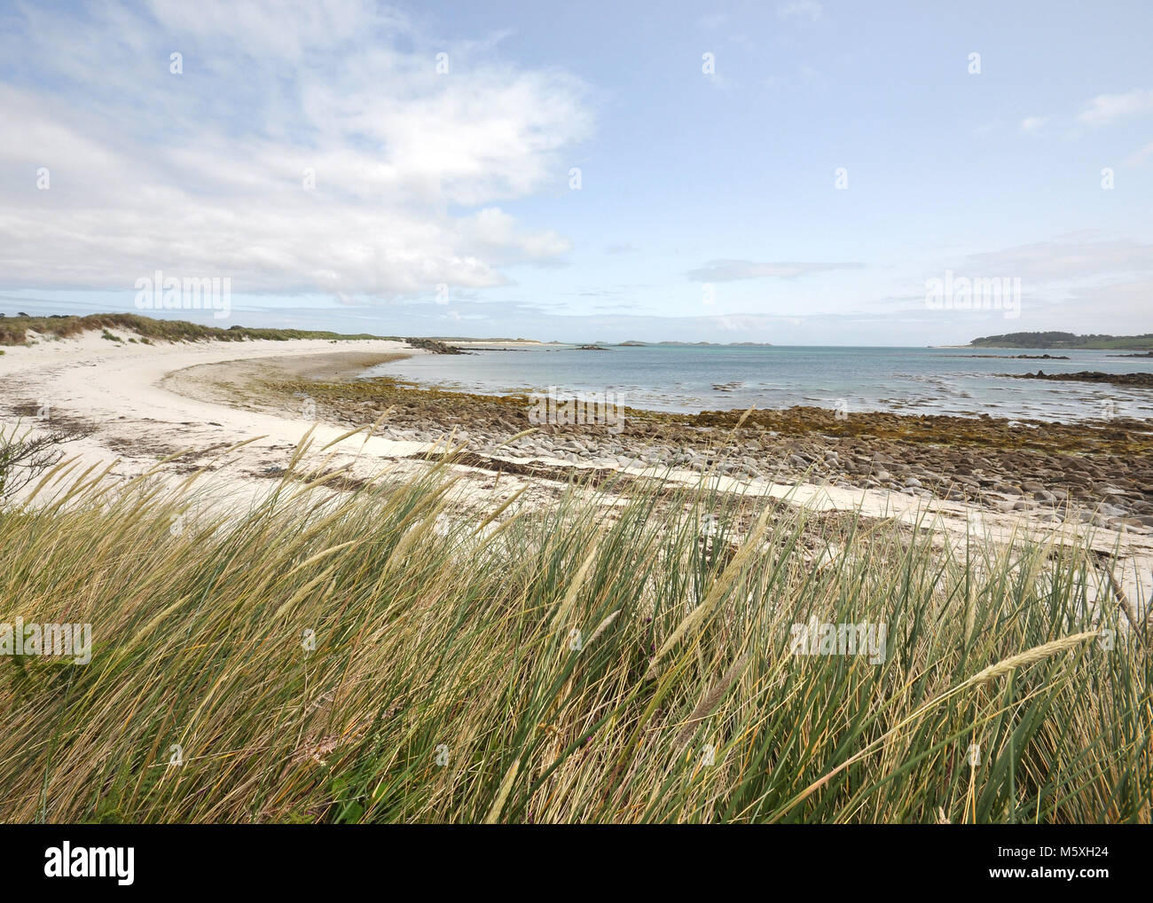 Sunny beaches of the Scilly Isles, United Kingdom. View of a bay with ...