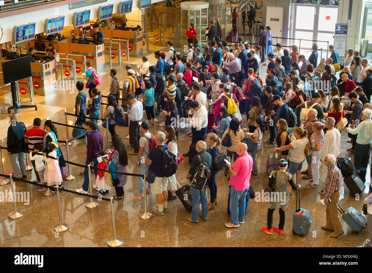 Immigration border control queue hi-res stock photography and images ...