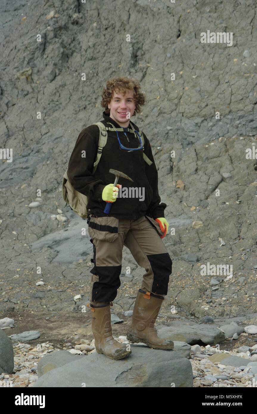 Young Handsome British Geologist, Fossil Hunting on Charmouth Beach ...