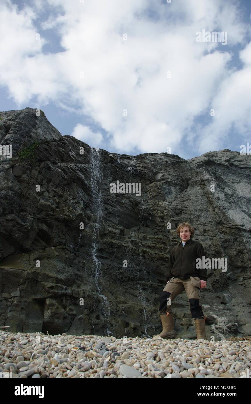 Young Handsome British Geologist, Fossil Hunting on Charmouth Beach ...