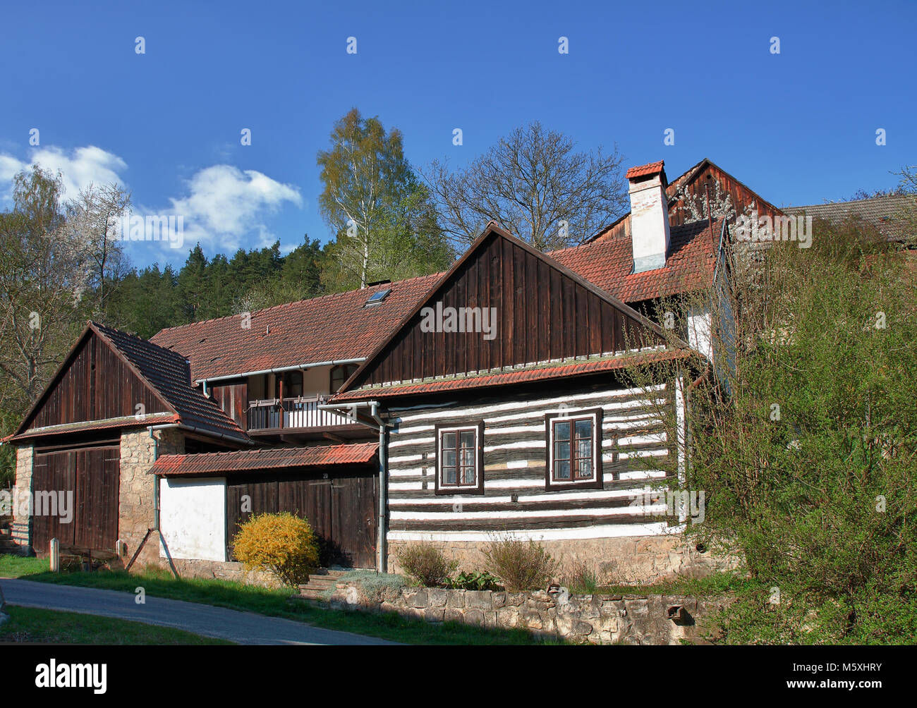 Classic czech wooden house in the spring day in small village Stock ...