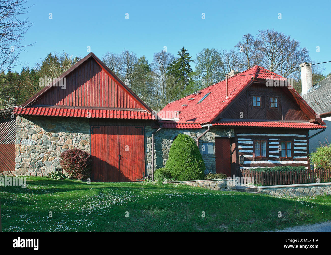 Classic czech wooden house in the spring day in small village Stock ...