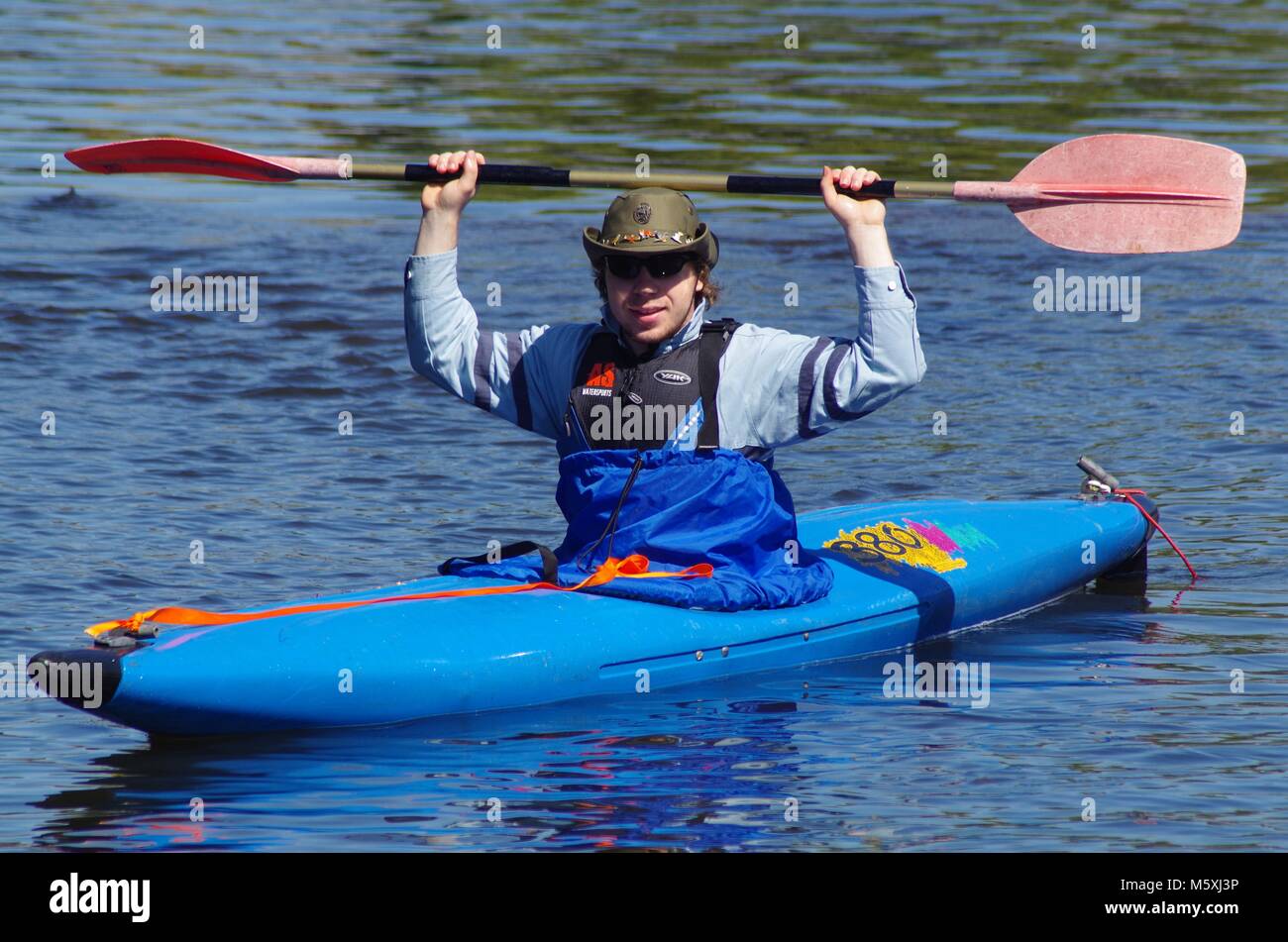Young Handsome Man, River Kayaking in a Blue Kayak on the River Exe ...