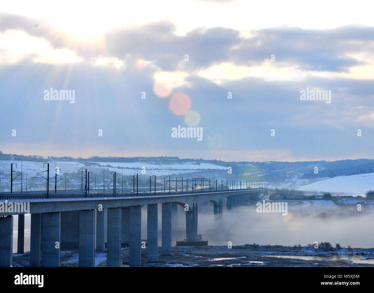 Medway Bridge at sunrise and early morning with sunrise and misty, cold ...