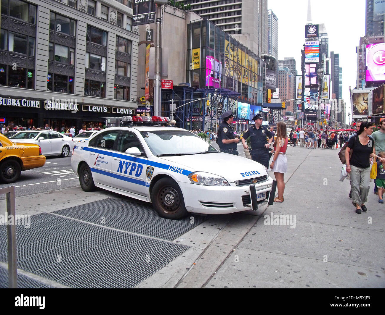 NYPD police car and officers in Times Square New York United States of ...