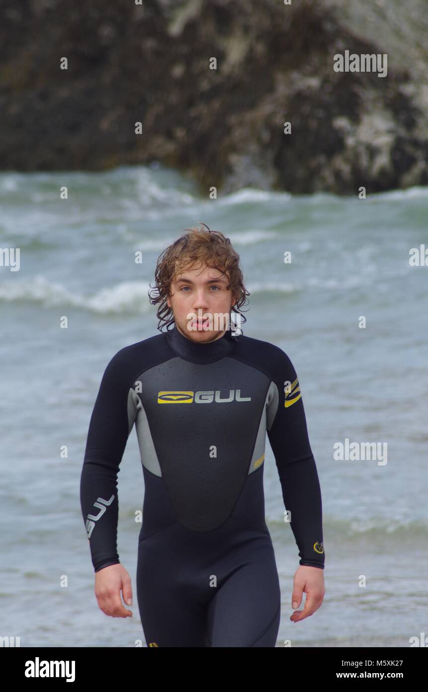 Young, Ruggedly Handsome British Surfer, in a Wetsuit on Holywell Beach ...