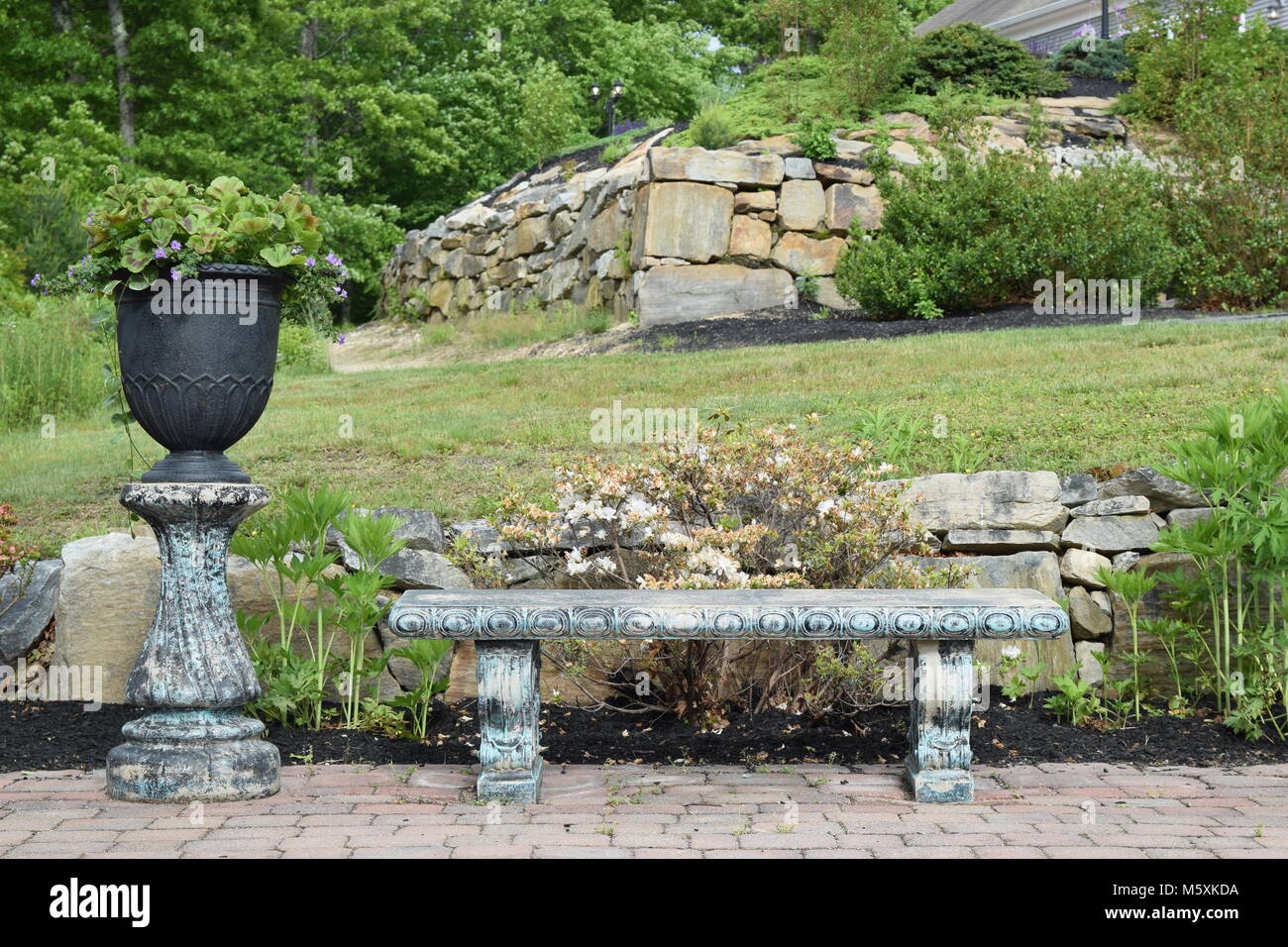 Stone bench sitting area Stock Photo - Alamy