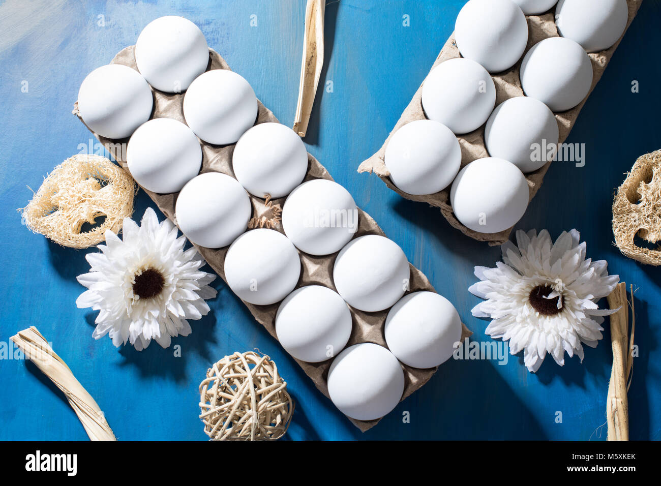 Clean white eggs on a deep blue background, flat lay Stock Photo - Alamy