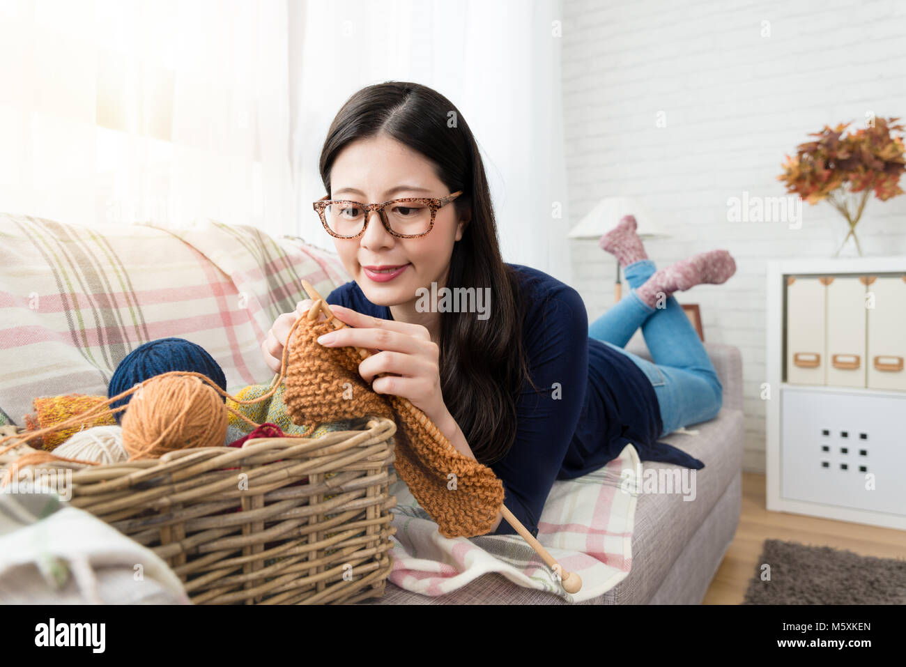 Beautiful Asian Women Lie Down On The Sofa Of The Living Room And