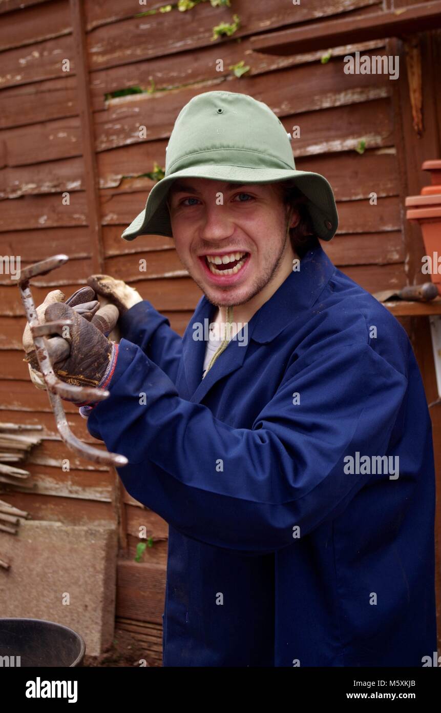 Digging Fork Wielding Scruffy Gardener in a British Back Yard. Grow ...