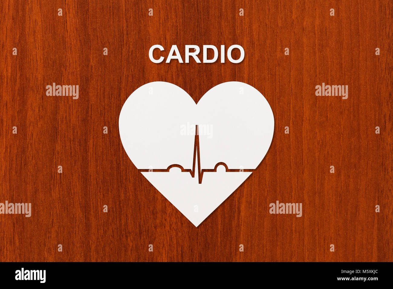 Heart shape with echocardiogram and CARDIO text . Sport or cardiology ...