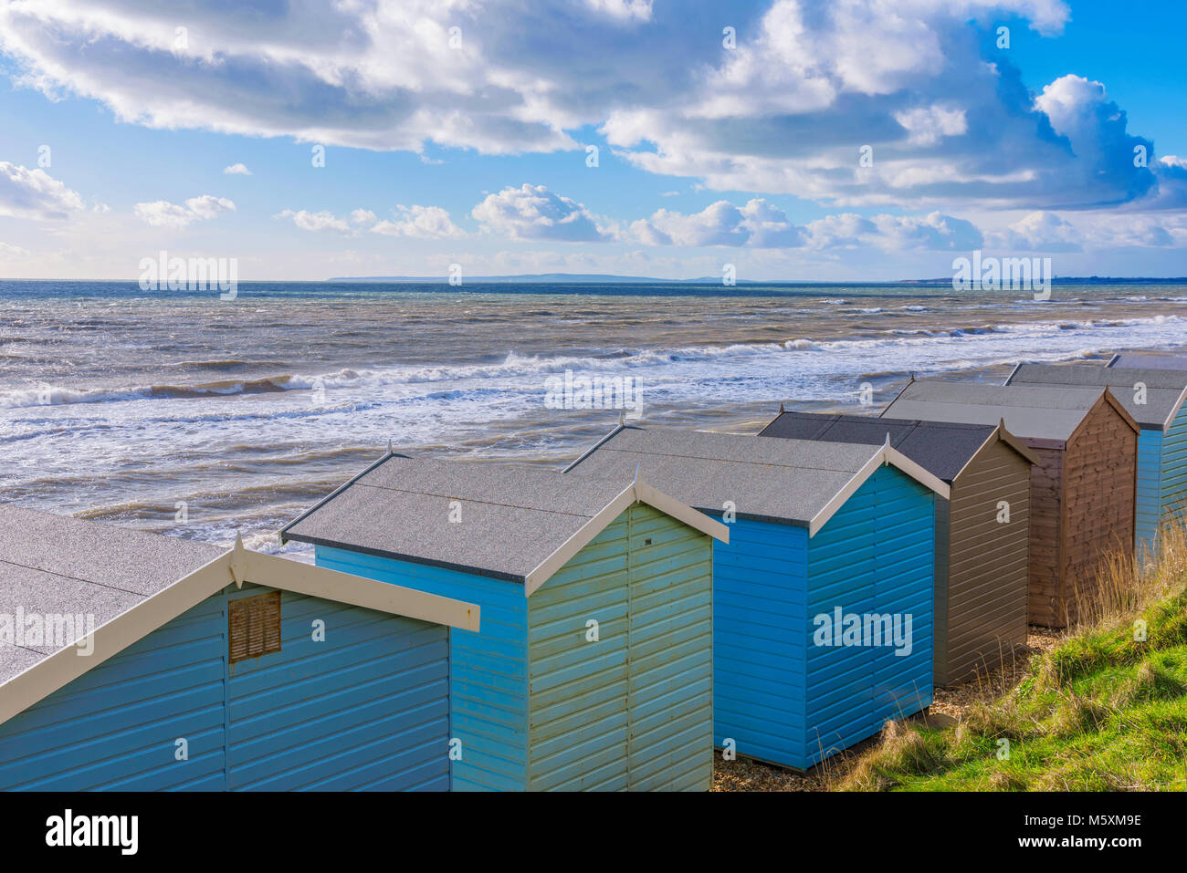 Beach huts with sea view in England Stock Photo - Alamy