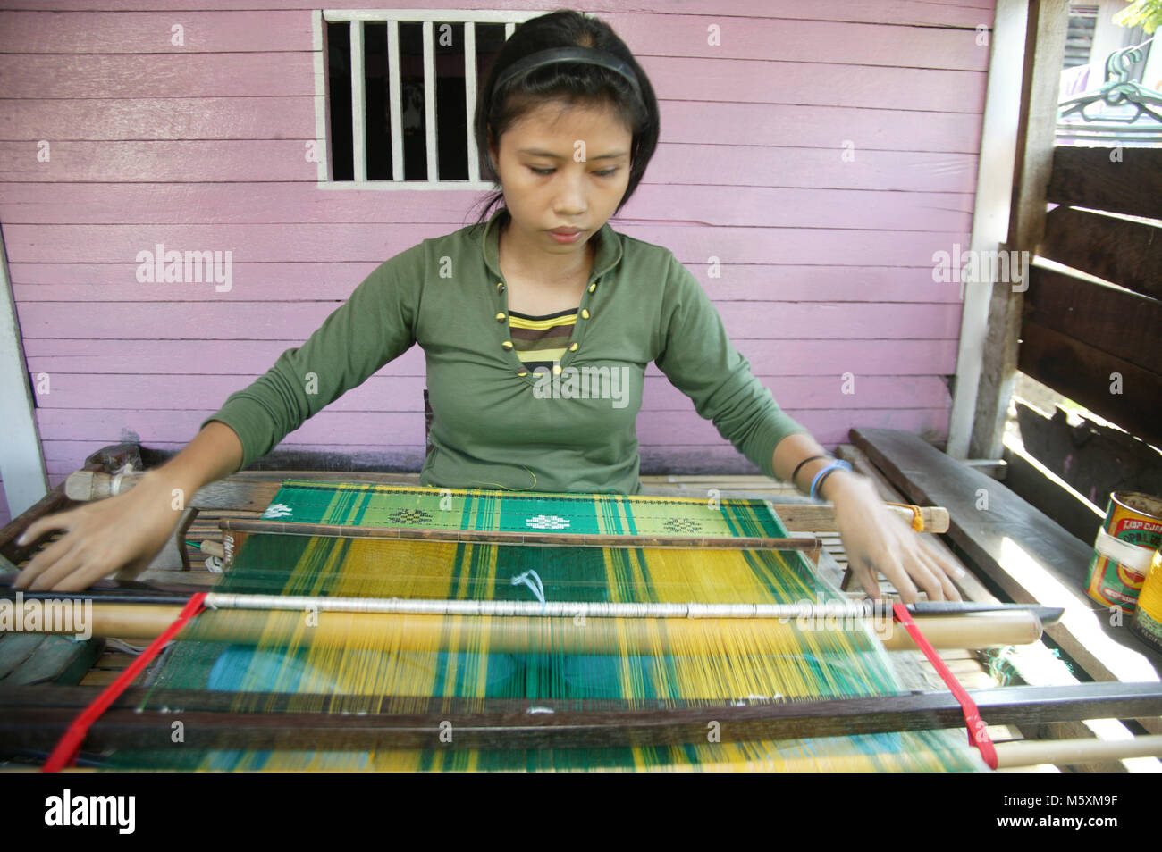 SENGKANG, INDONESIA. 30th June 2009. Buginese women traditional silk ...