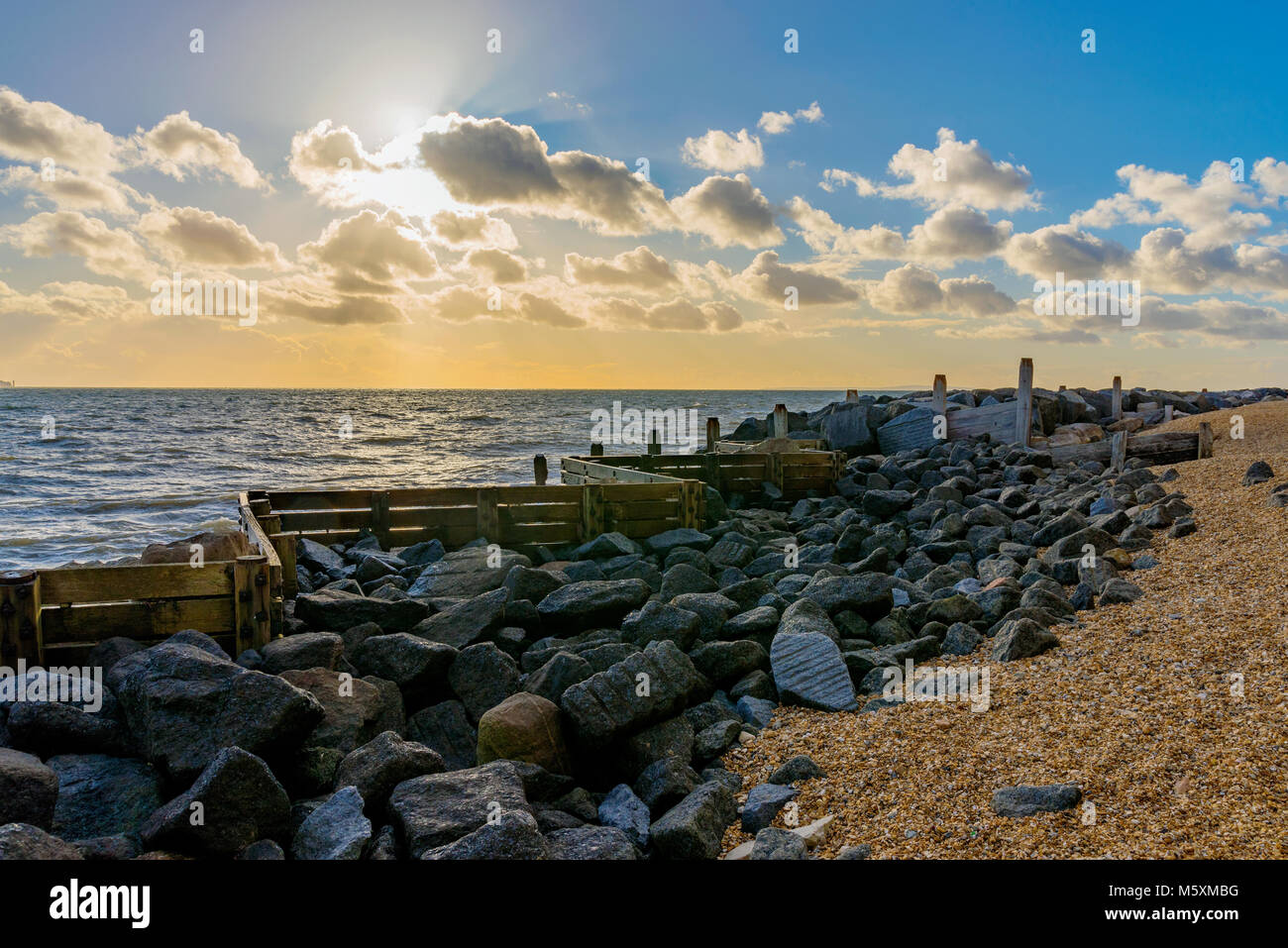 Pebble beach during sunset at Hurst Point, UK Stock Photo - Alamy