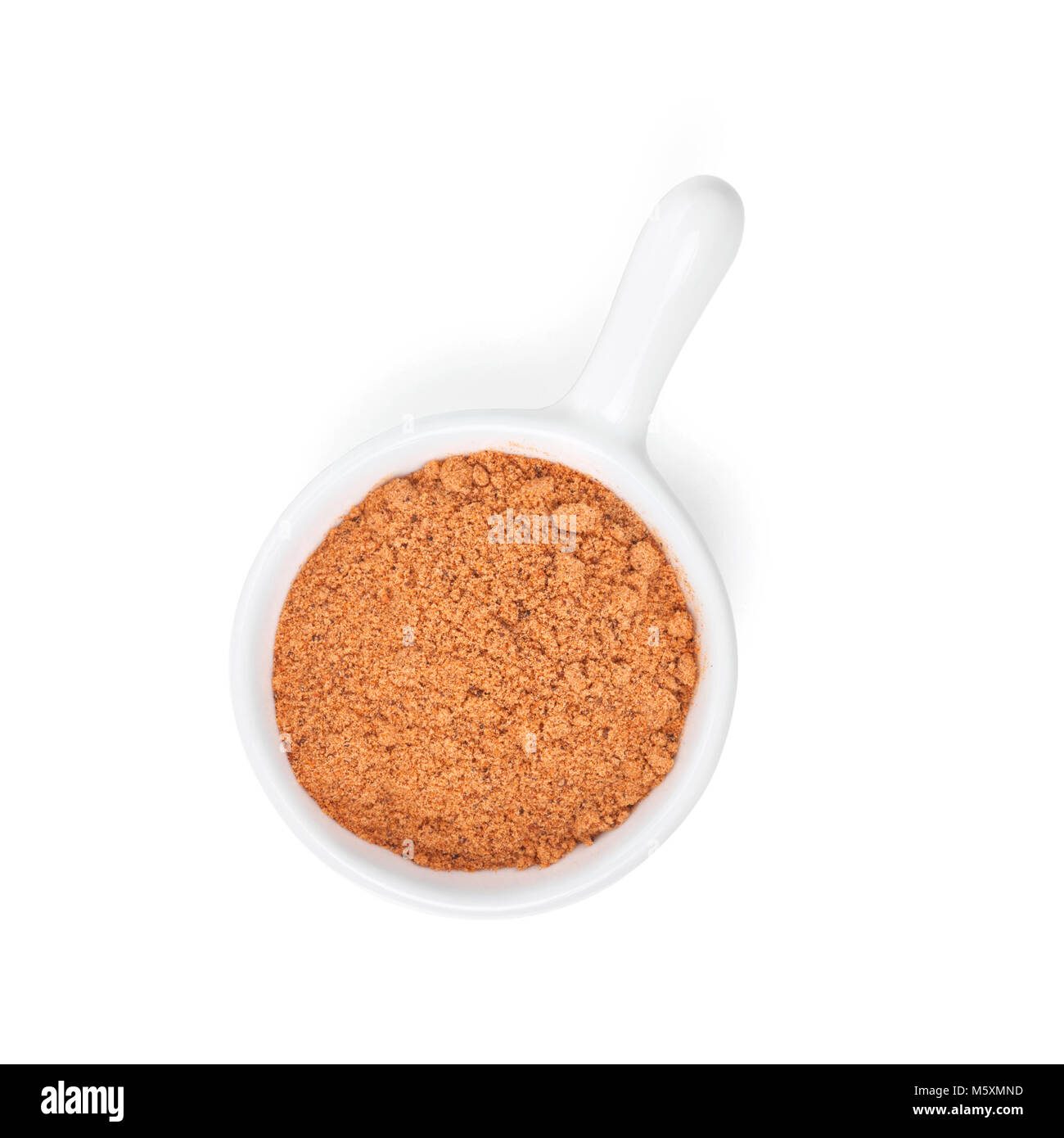 Nutmeg powder. Isolated on white background Stock Photo - Alamy