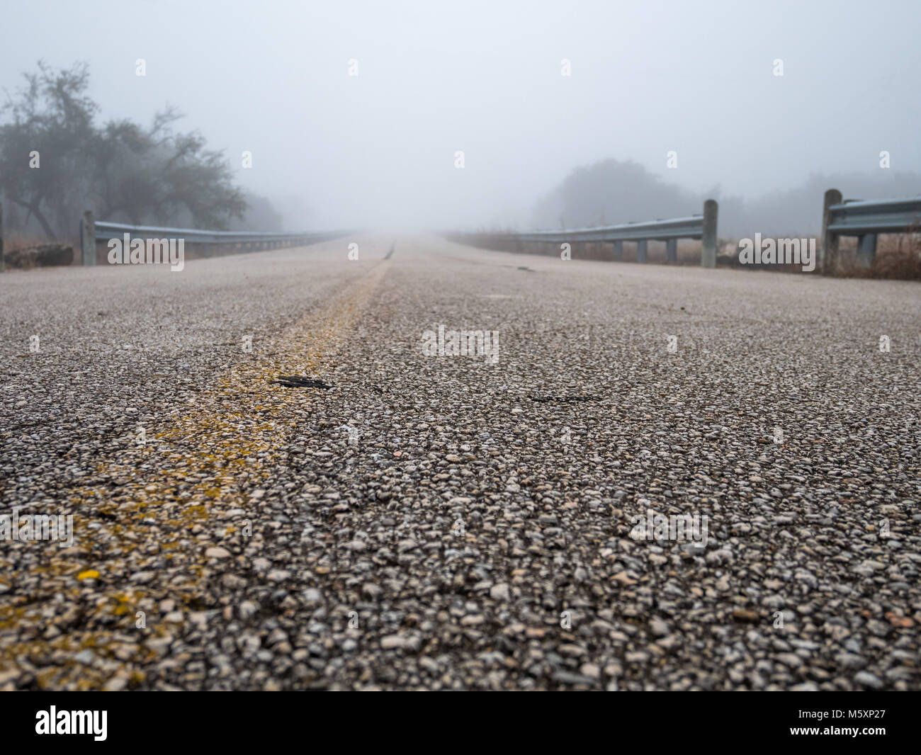 Low Angle View of Road Leading to Dense Fog Stock Photo - Alamy